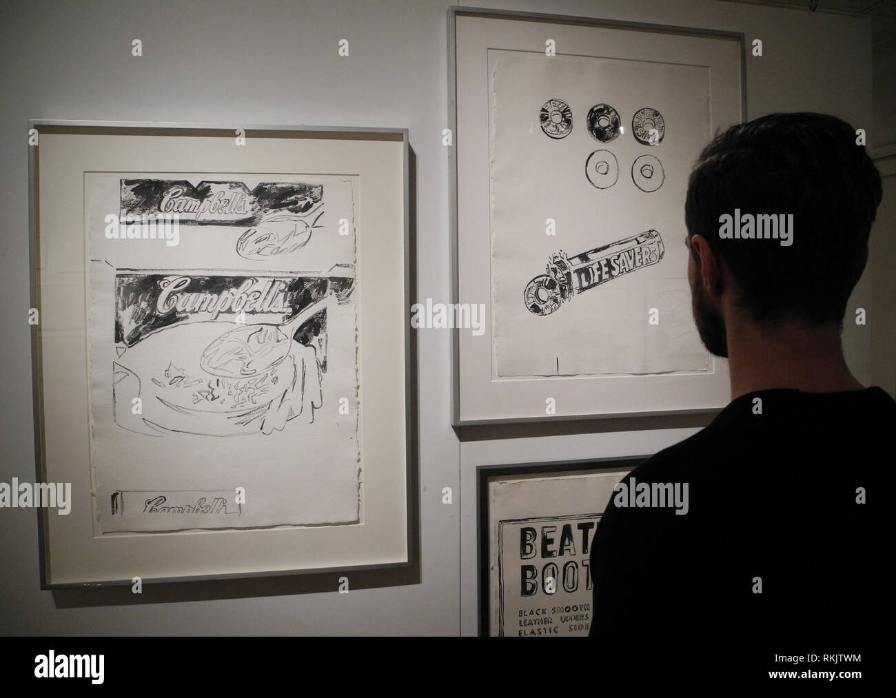 New York, USA. 24th Jan, 2019. A visitor stands in front of drawings by pop artist Andy Warhol ...