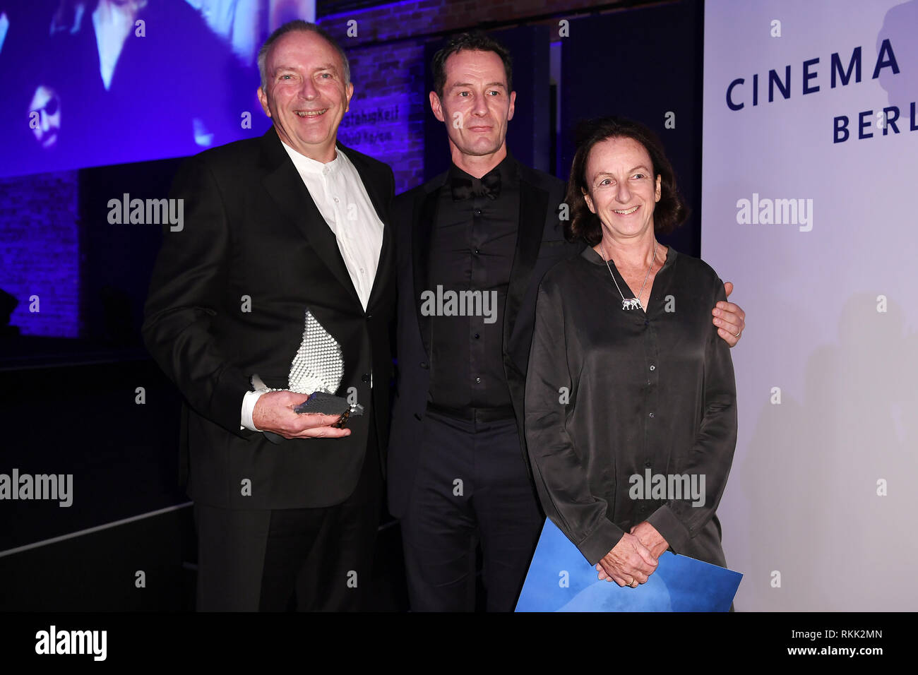 Berlin, Germany. 11th Feb, 2019. Sebastian Copeland (M) stands between ...