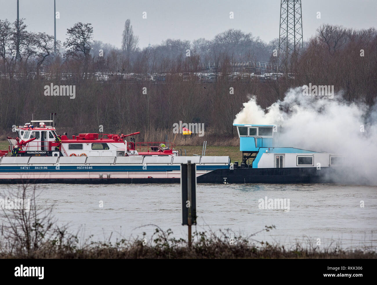 Duisburg, Germany. 12th Feb, 2019. A ship is burning on the Rhine near ...