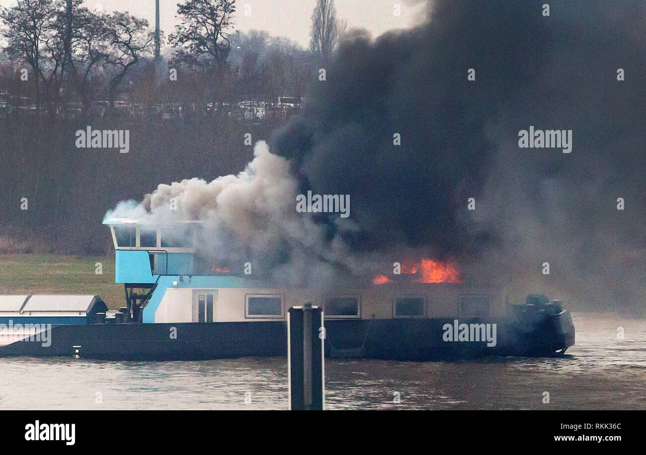 Duisburg, Germany. 12th Feb, 2019. A ship is burning on the Rhine near ...