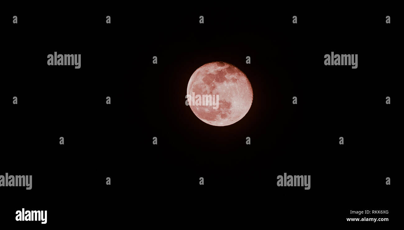Detailed photo through telescope of waning gibbous moon phase red moon ...
