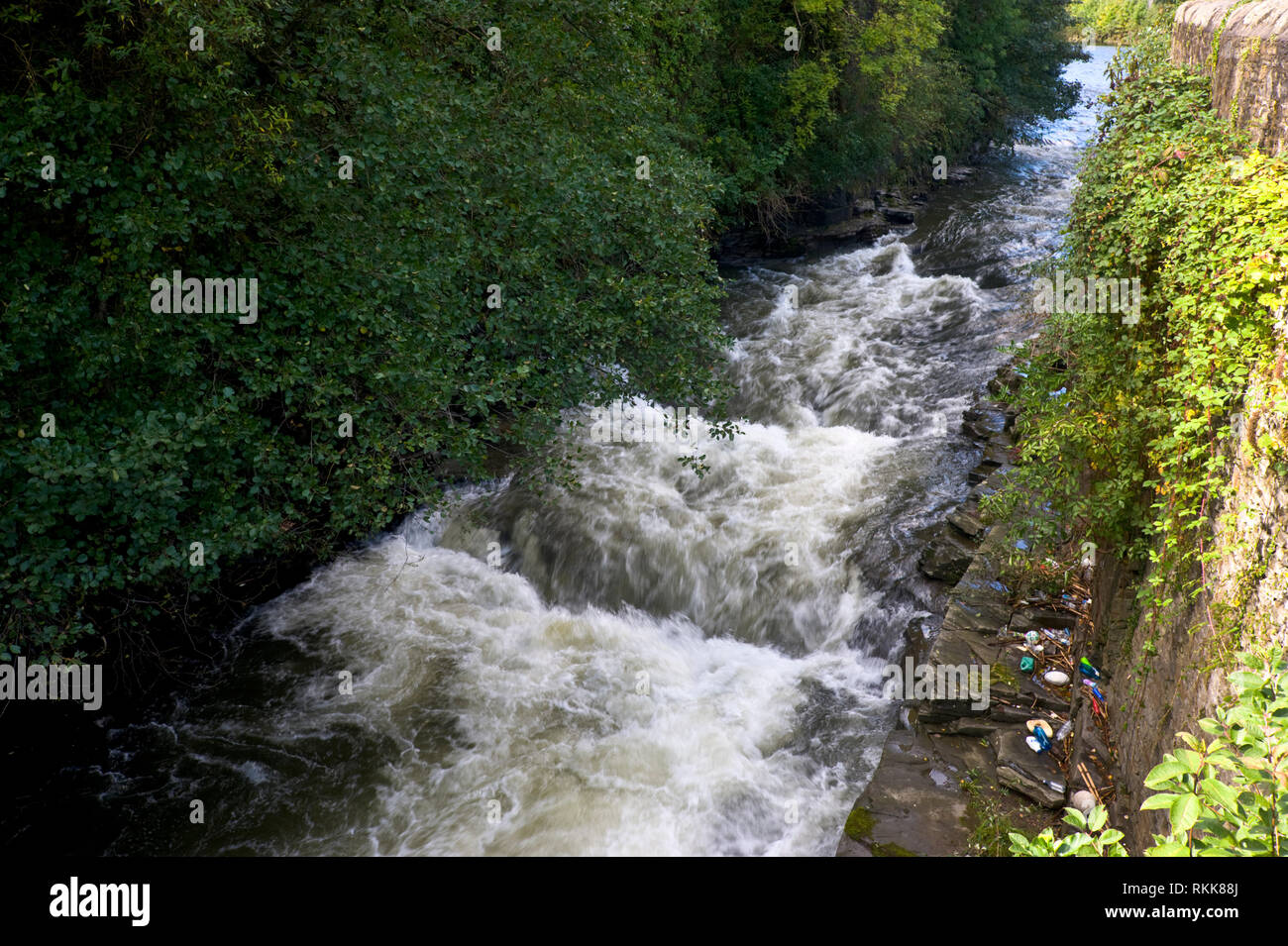 Rhondda River with plastic debris on riverbank at Hopkinstown near ...
