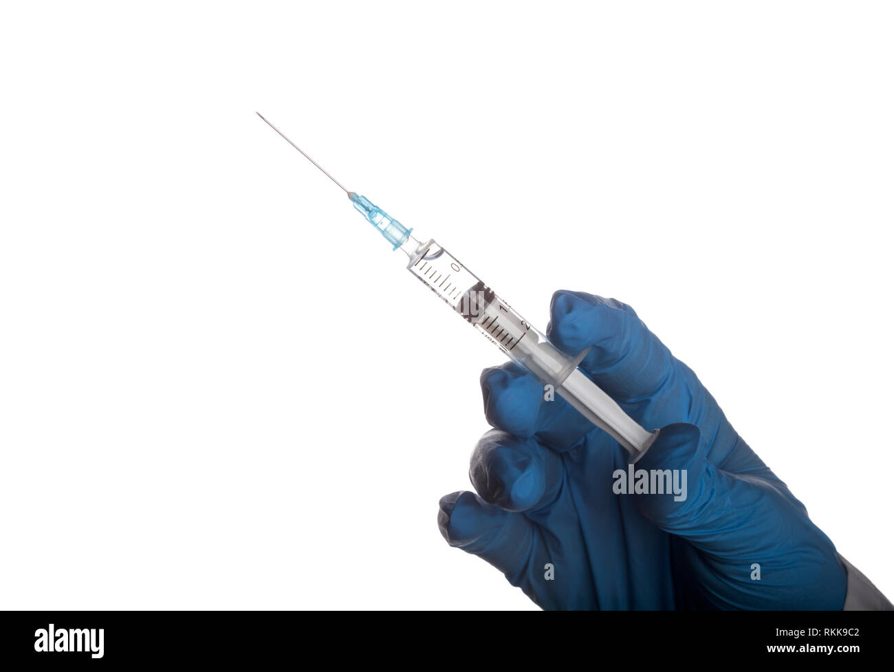 A syringe with an injection solution.The doctor is holding a syringe ...