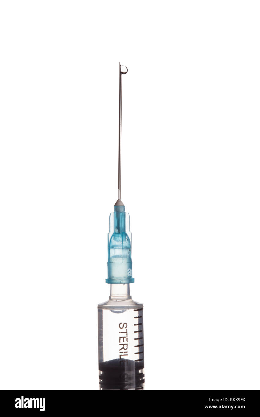 A syringe with an injection solution on white background with copy ...