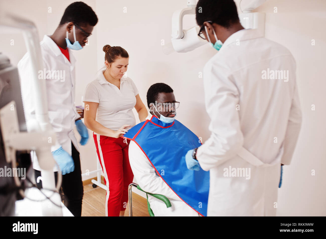 Multiracial doctors team. African american male doctors with one ...
