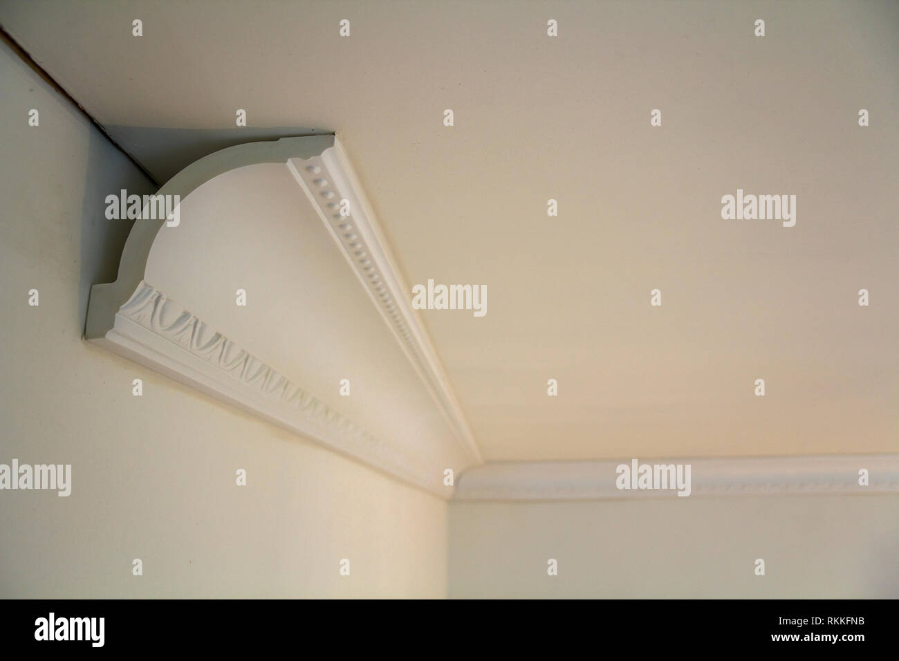 Close-up detail of decoration white molding connected with glue ...