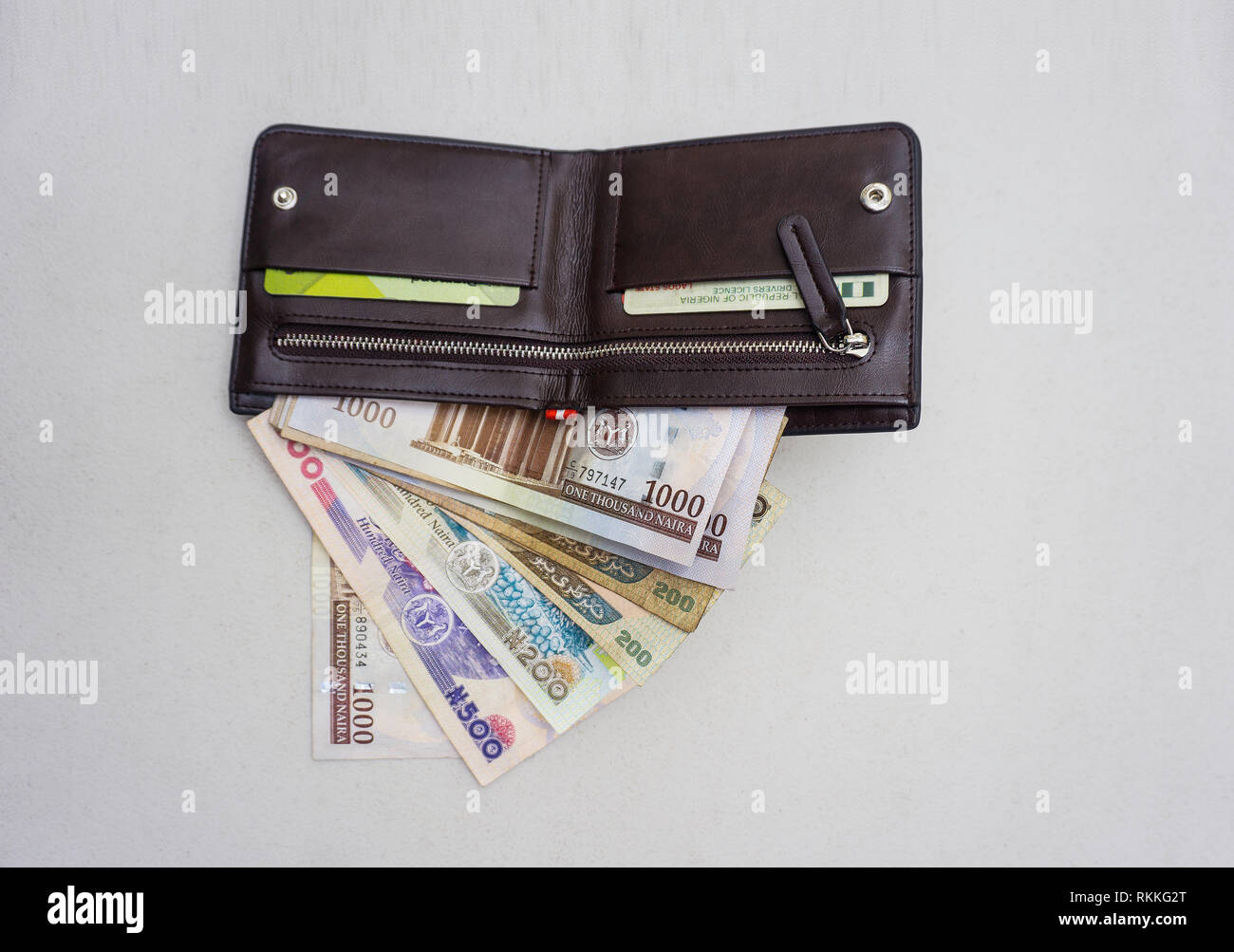 Nigerian Naira - A wallet with naira notes of different denominations ...