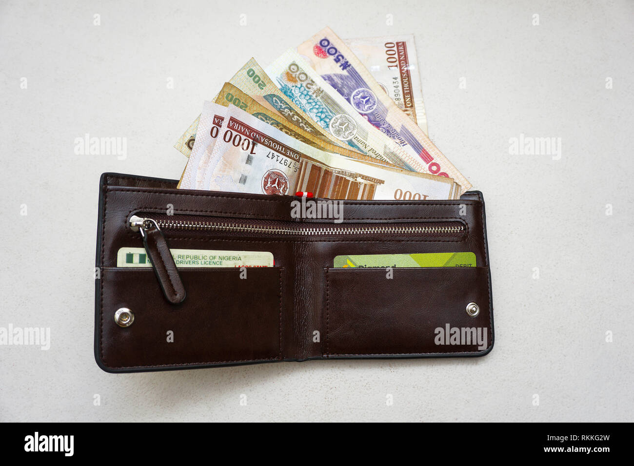 Nigerian Naira - A wallet with naira notes of different denominations ...