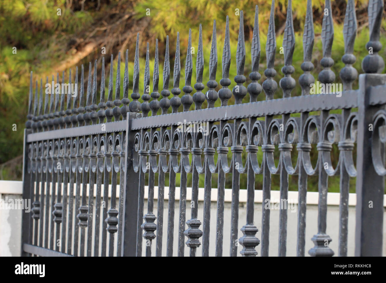 Metal curly fence in the park / Details Stock Photo - Alamy