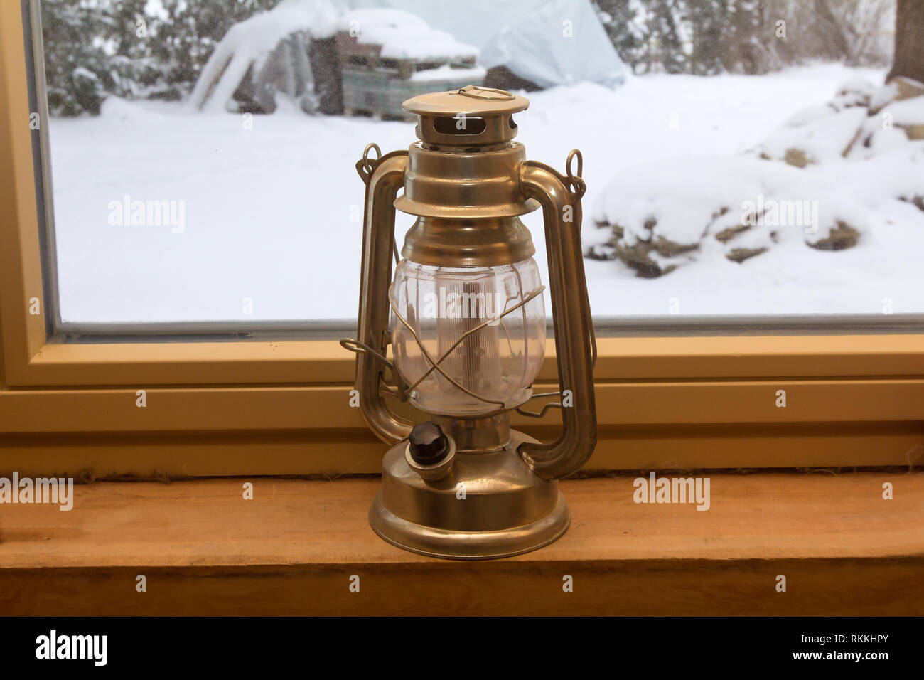 An old lamp standing on a windowsill Stock Photo - Alamy