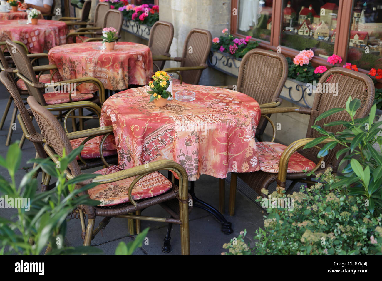 Cozy street restaurant. Tables and chairs in the streets Stock Photo ...