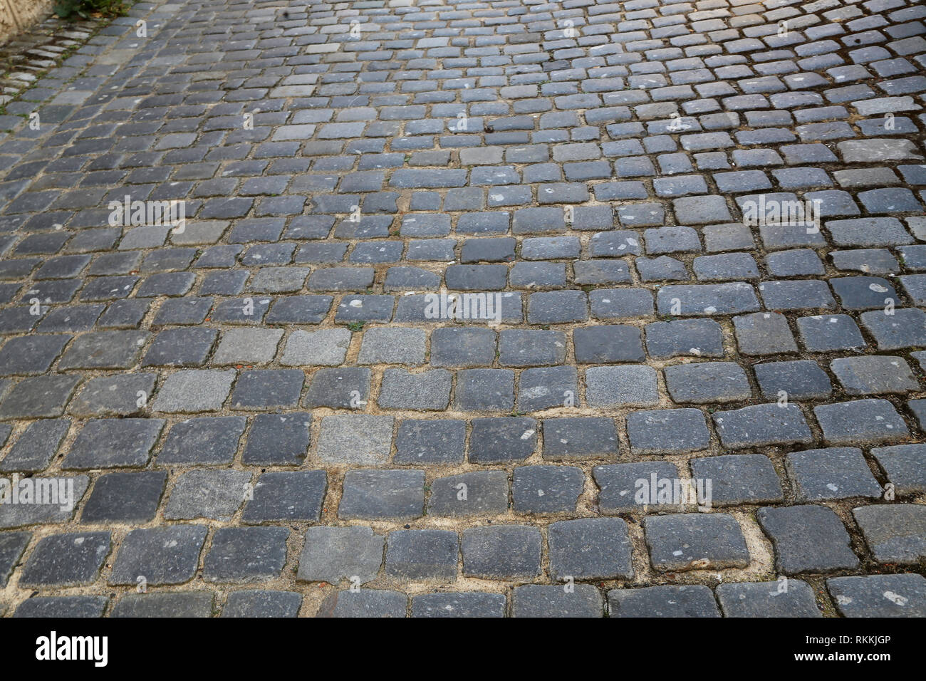 Old cobbled surface of the road in the city Stock Photo - Alamy