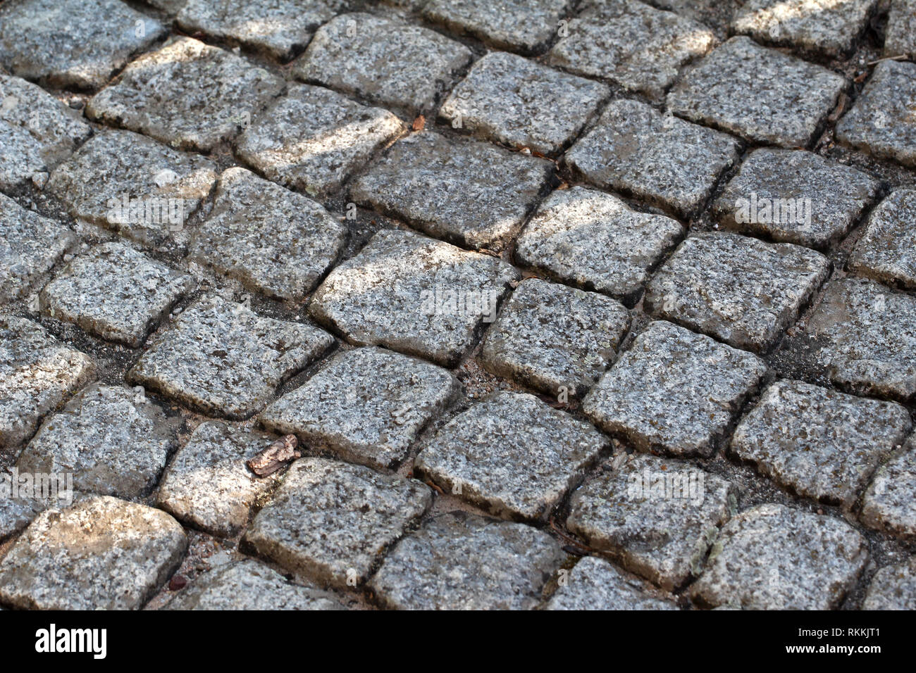 Old cobbled surface of the road in the city Stock Photo - Alamy