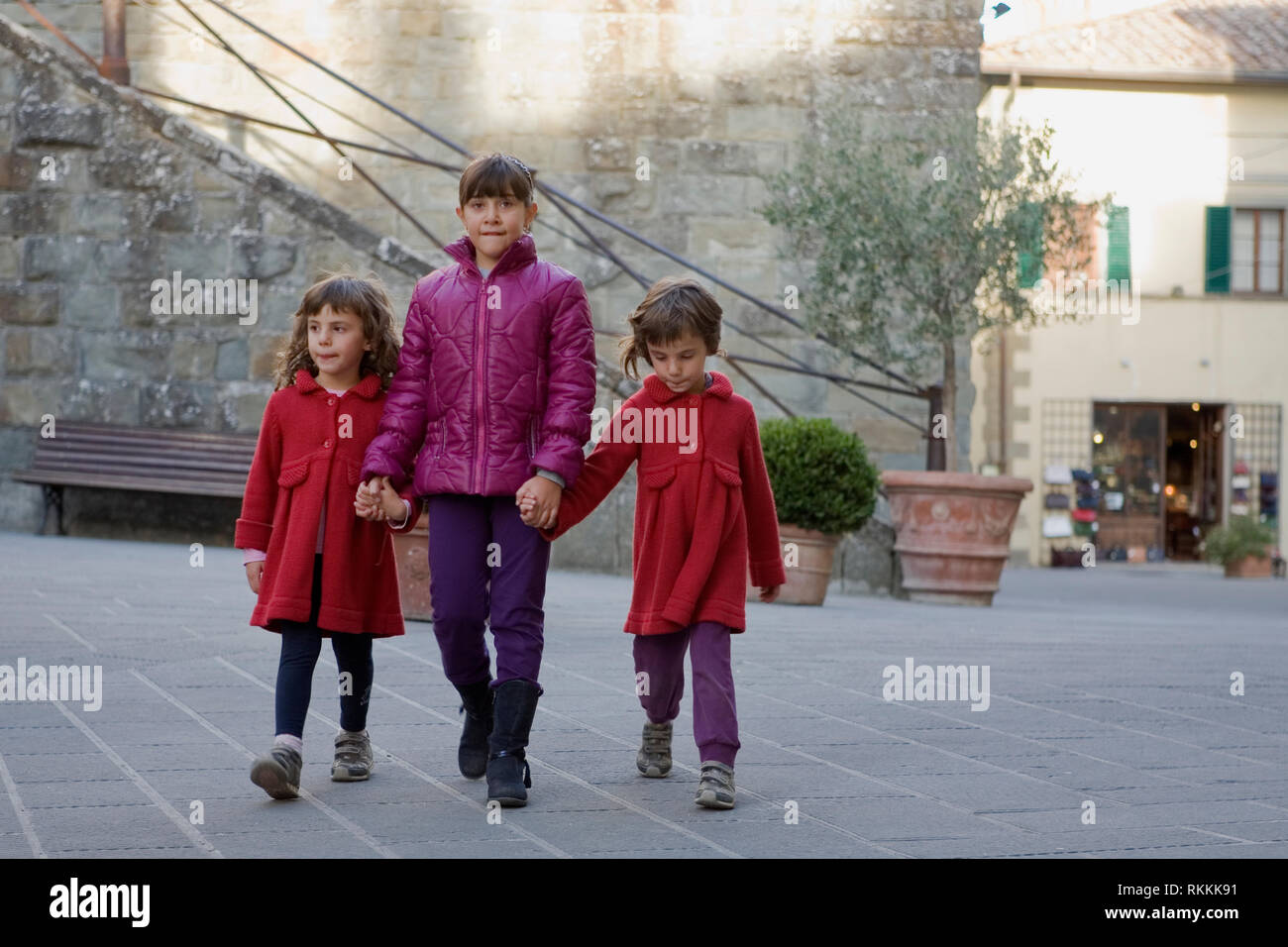 Twin sisters holding hands hi-res stock photography and images - Alamy