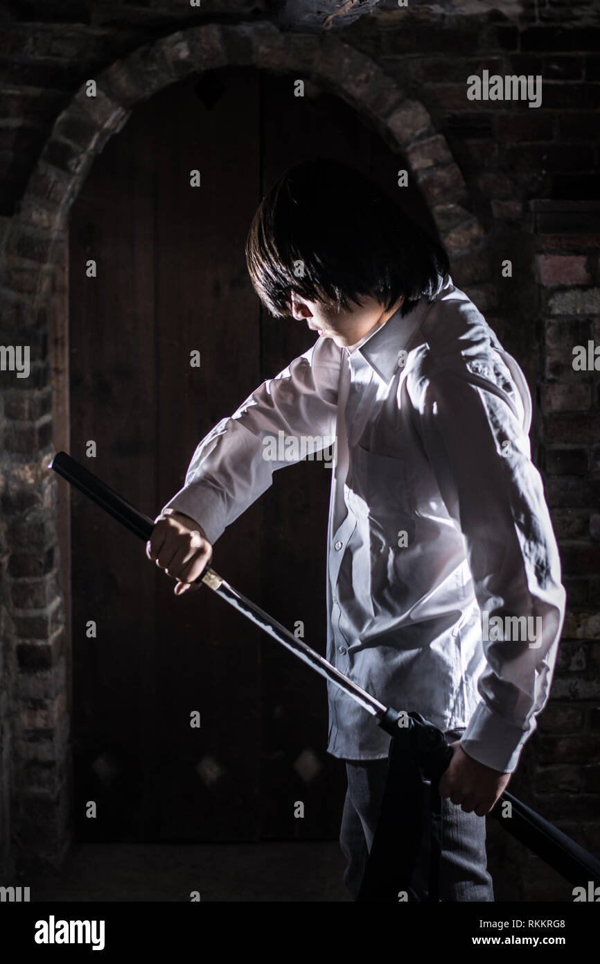 Man holding sword hi-res stock photography and images - Alamy