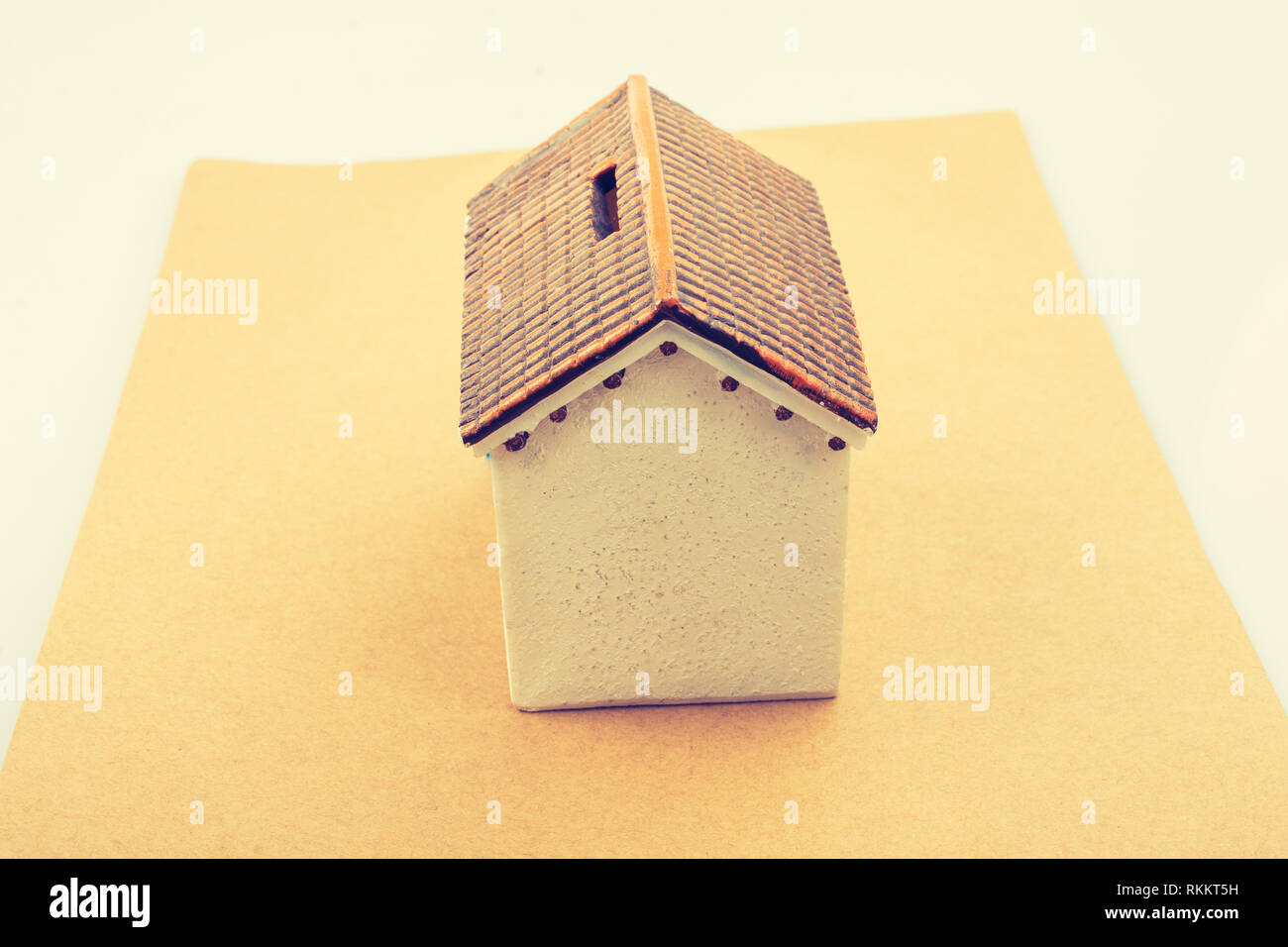 Little model house with a sign board in the view Stock Photo - Alamy