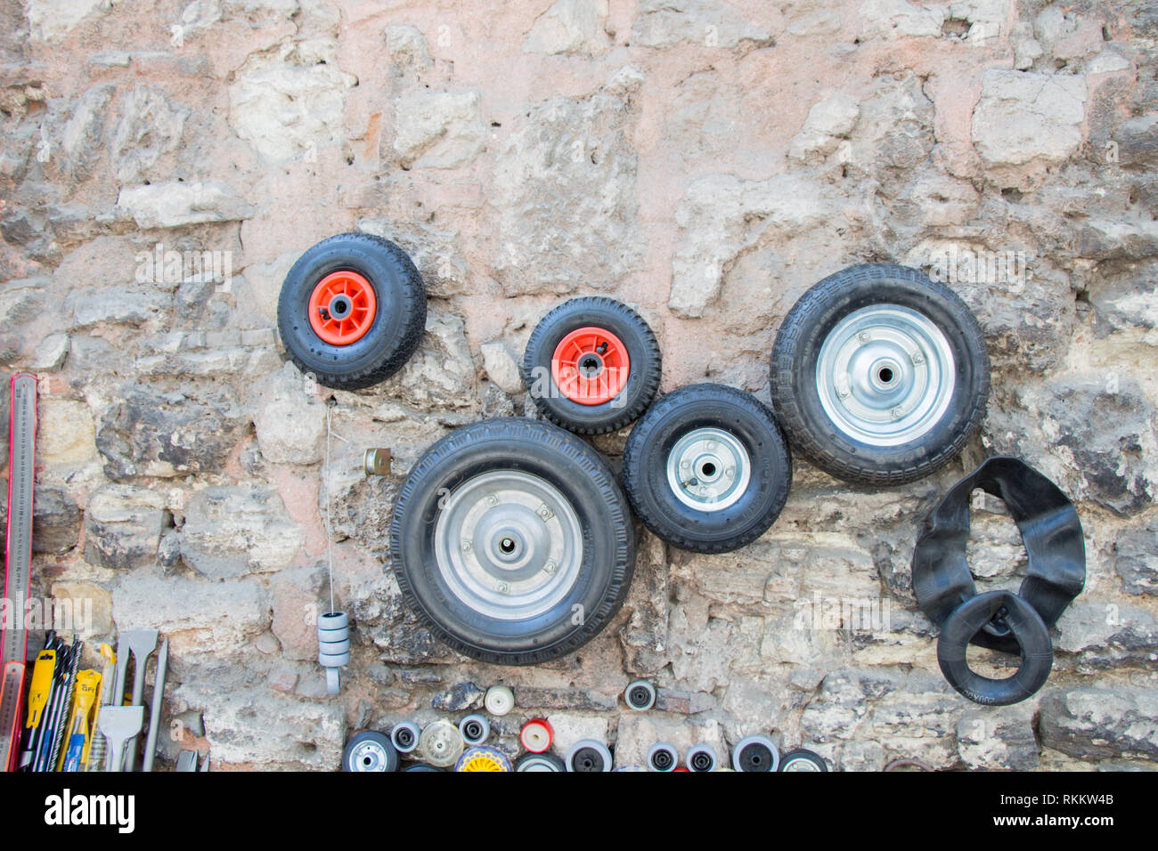 Various sized, colored and shaped wheels in the view Stock Photo - Alamy