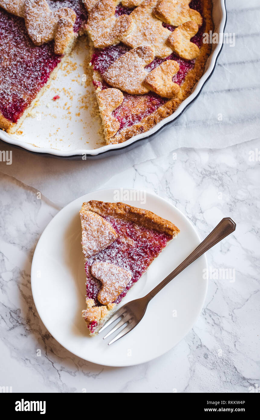 Raspberries jam pie with heart shape decorations. Delicious festive ...