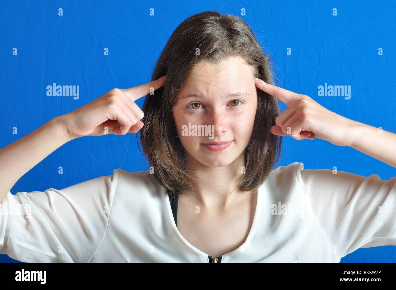 Portrait of teenage girl thinking Stock Photo - Alamy