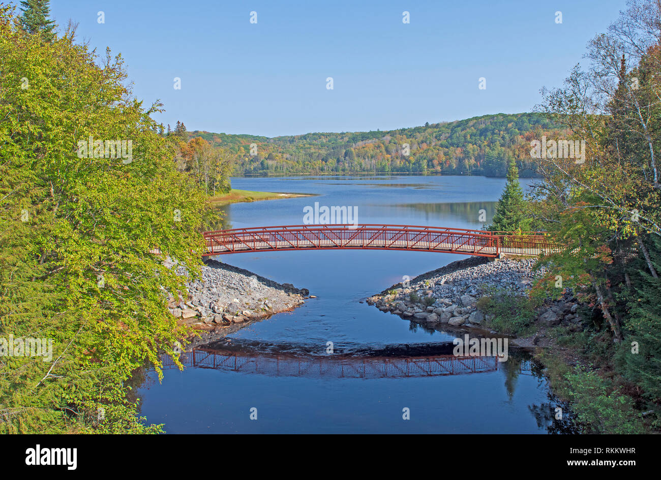 Graceful Footbridge by Arrowhead Lake in the North Woods of Arrowhead Provincial Park in Ontario ...