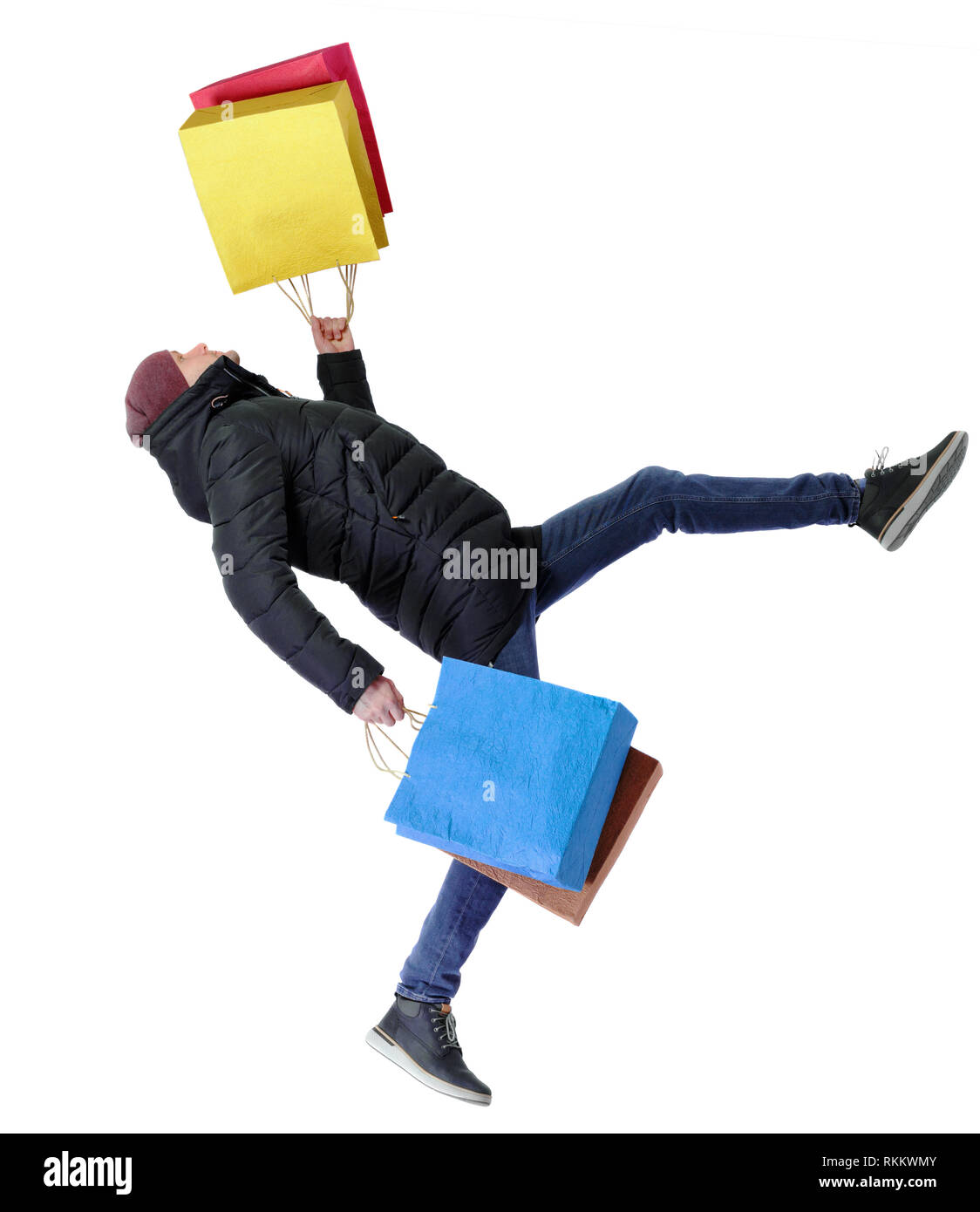 Falling man in winter jacket with shopping bags. Guy in motion ...