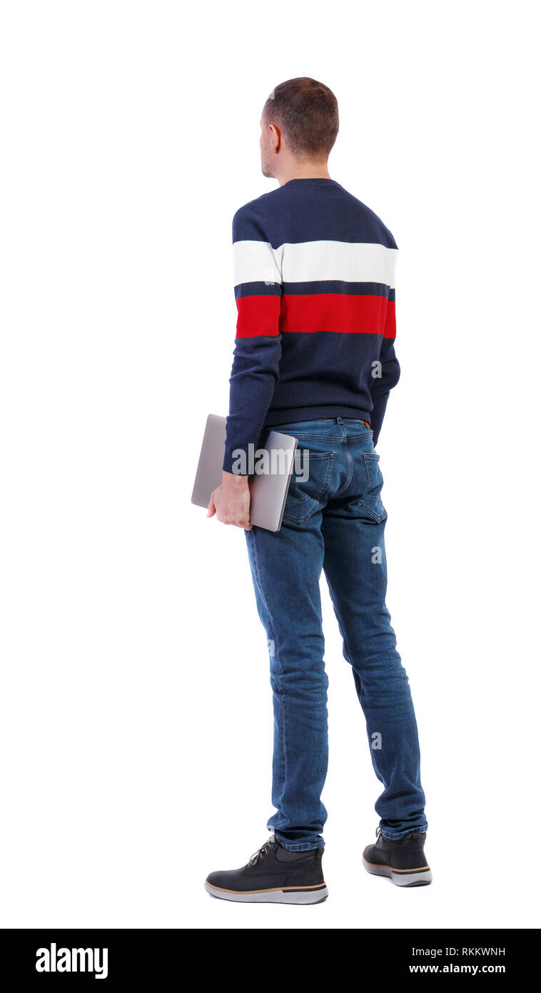 Back view of a man who is standing with a laptop. Rear view people ...