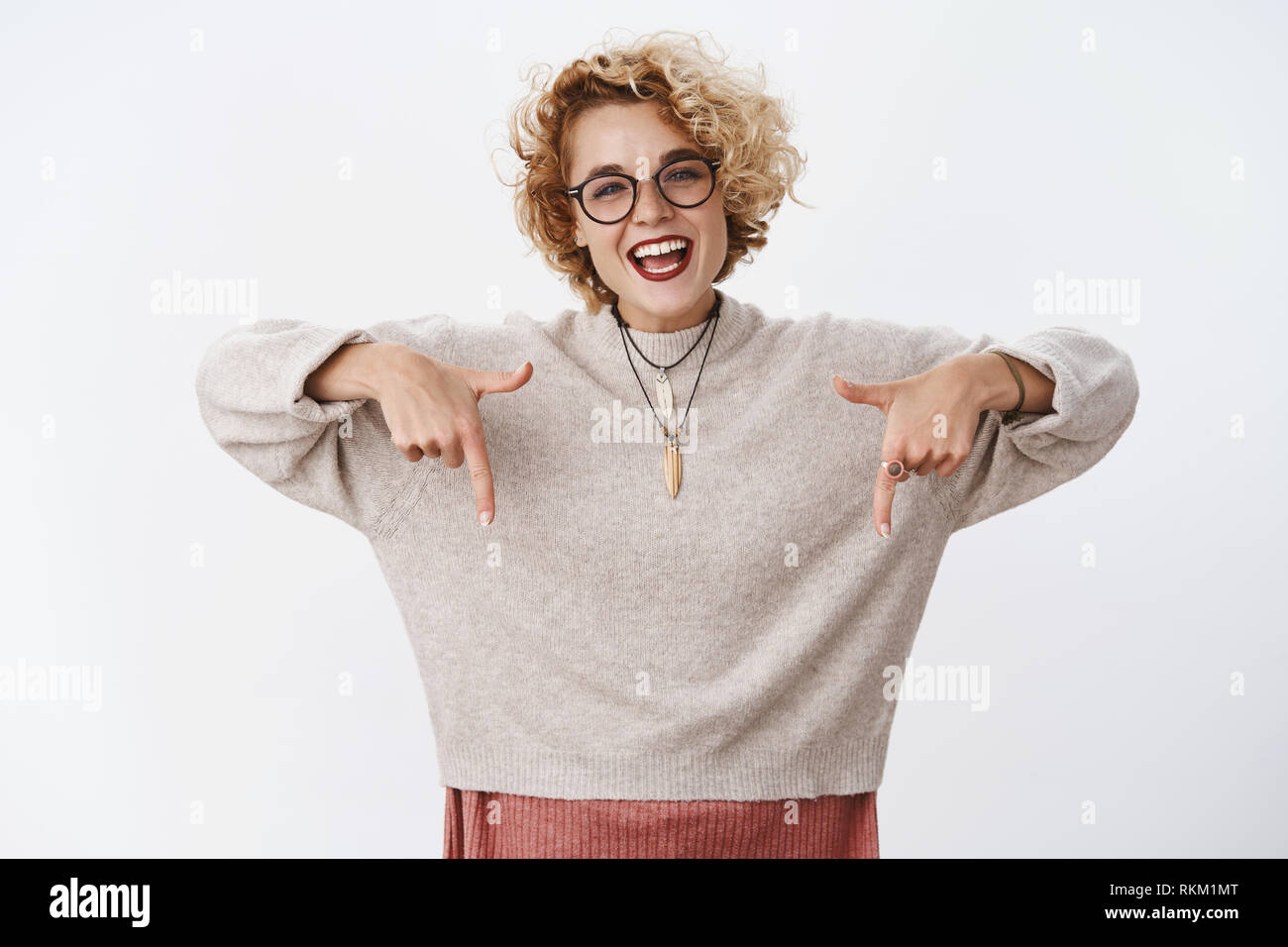 Bright and happy friendly-looking charming hipster girlfriend inviting ...