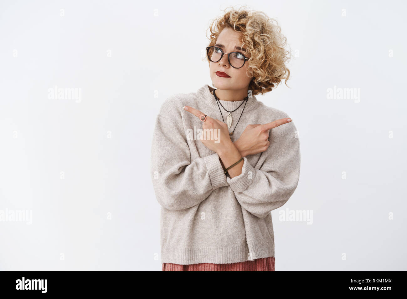 Woman raising eyebrow hi-res stock photography and images - Alamy