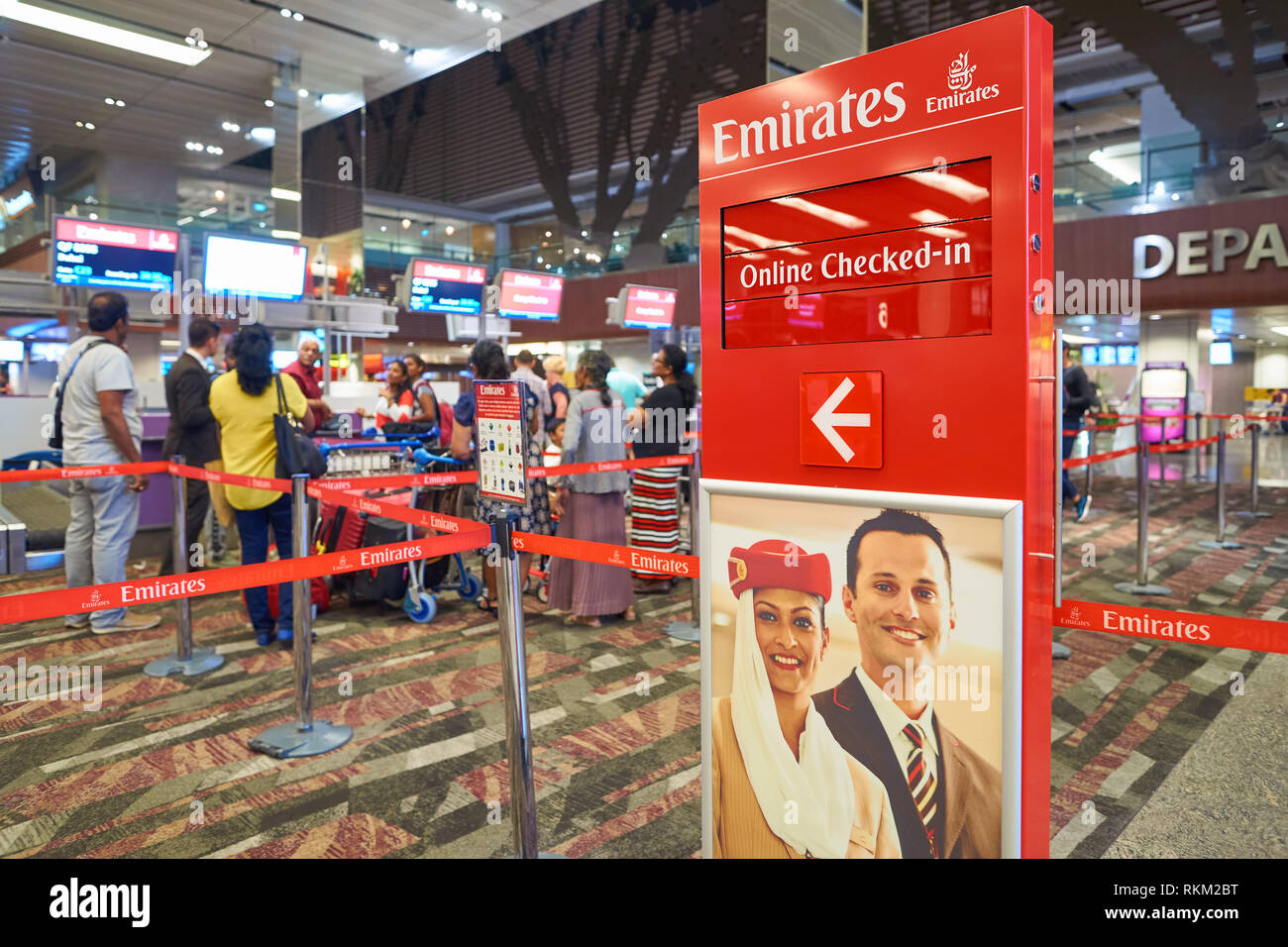SINGAPORE - AUGUST 28, 2016: Emirates check-in counters at Singapore ...
