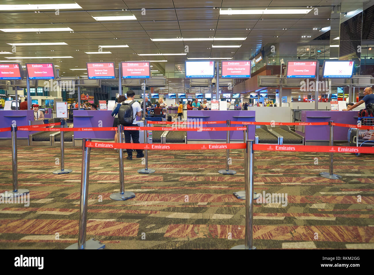 SINGAPORE - AUGUST 28, 2016: Emirates check-in counters at Singapore ...