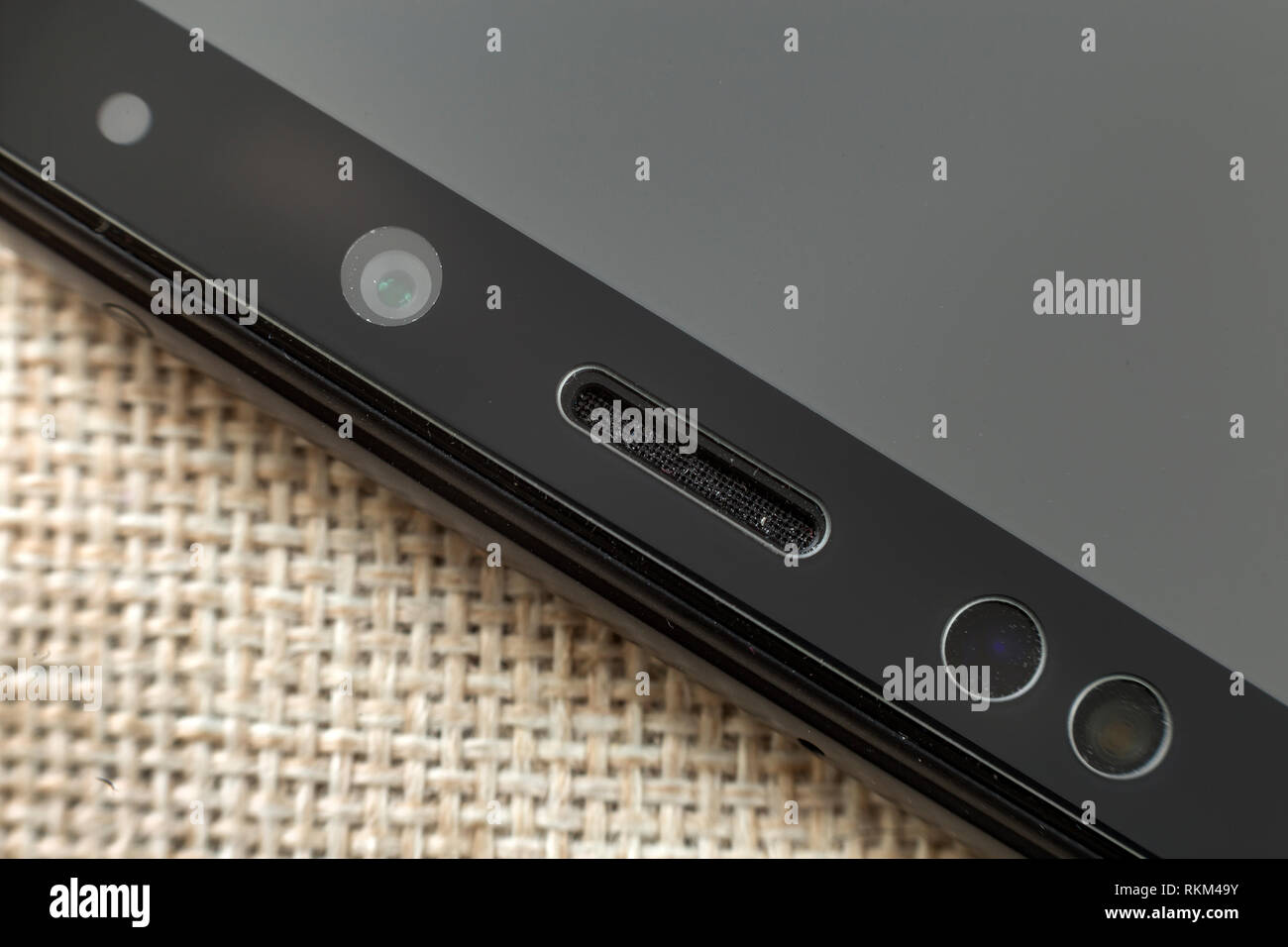 Close-up detai view of cellphone front camera, sensors and loudspeaker ...