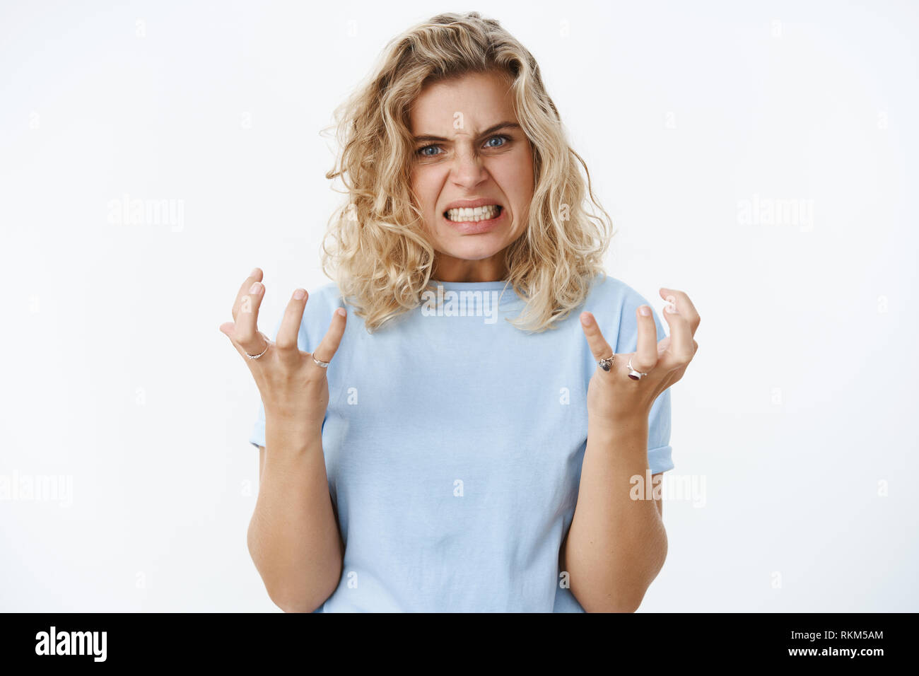 Girl gonna blow out over anger and distress clench teeth and fists in ...