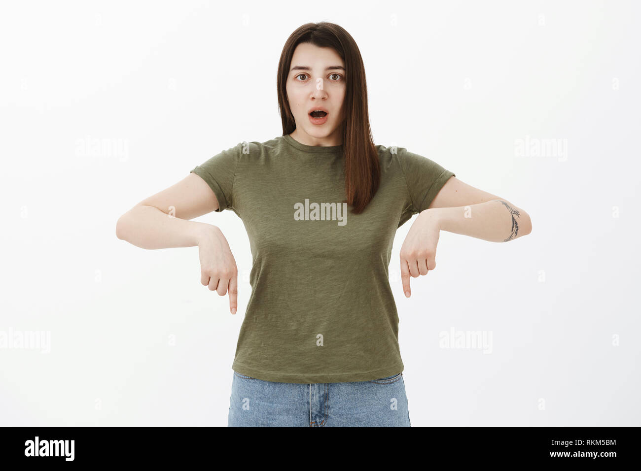 Omg look there. Portrait of concerned and shocked surprised young ...