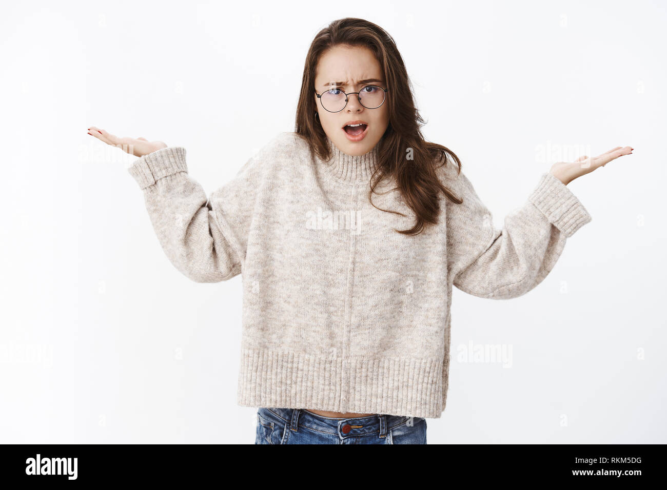 Annoyed and confused girl having argument standing questioned and ...