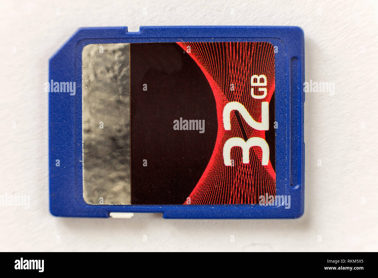 Close-up of blue micro SD memory card isolated on white copy space ...