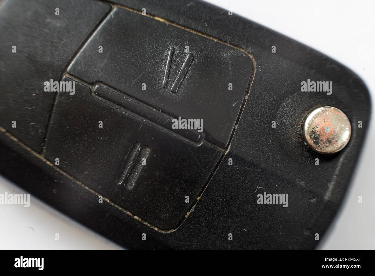 Close-up of car key with remote control buttons on white background ...