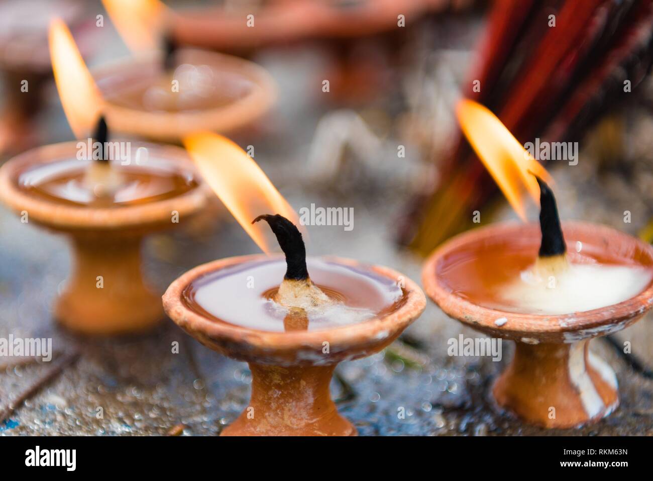 Burning oil lamps indian temple hi-res stock photography and images - Alamy