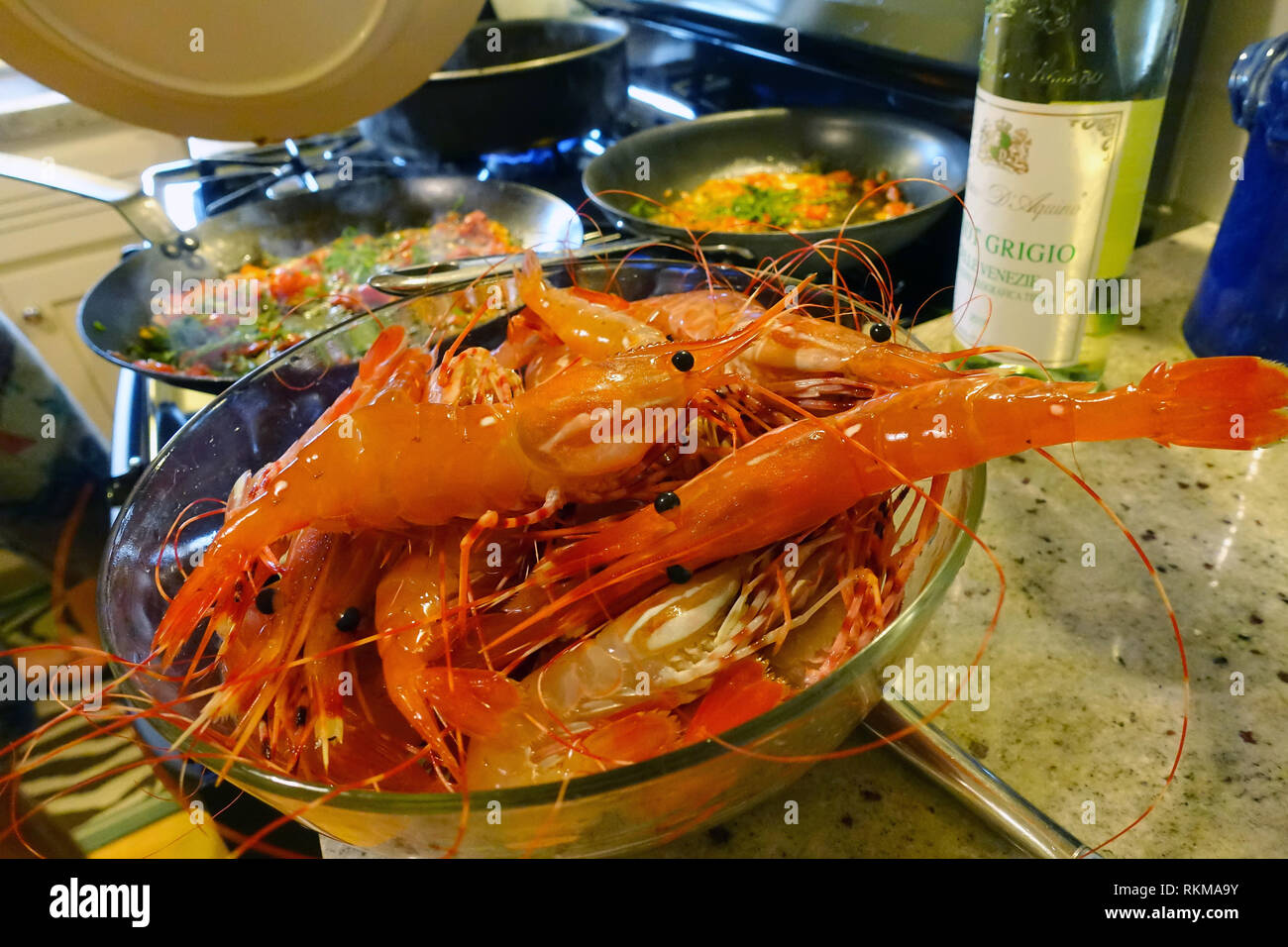 Fresh caught shrimp are cooked on a stove seasoned to perfection Stock ...