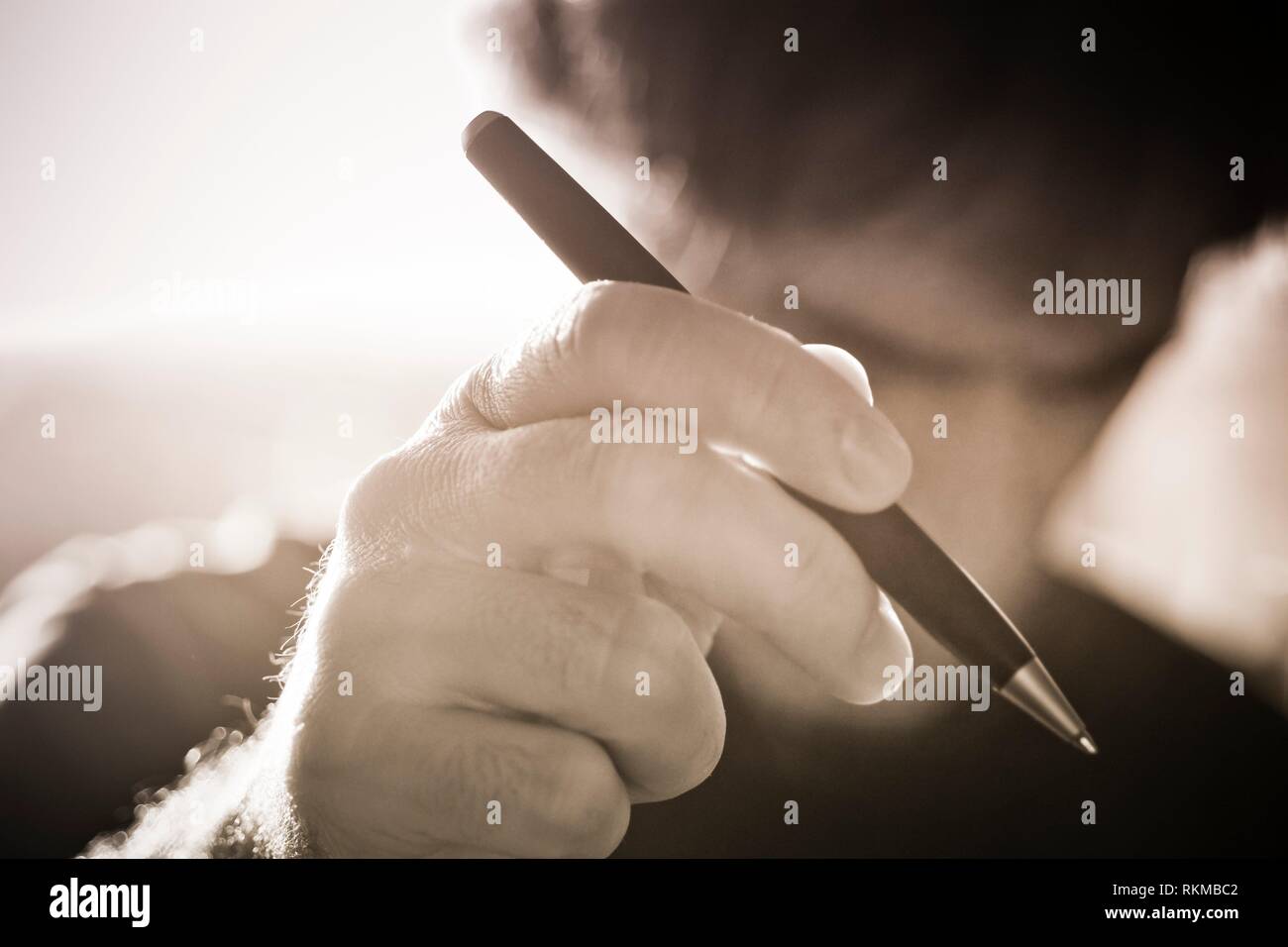 Holding the pen hi-res stock photography and images - Alamy
