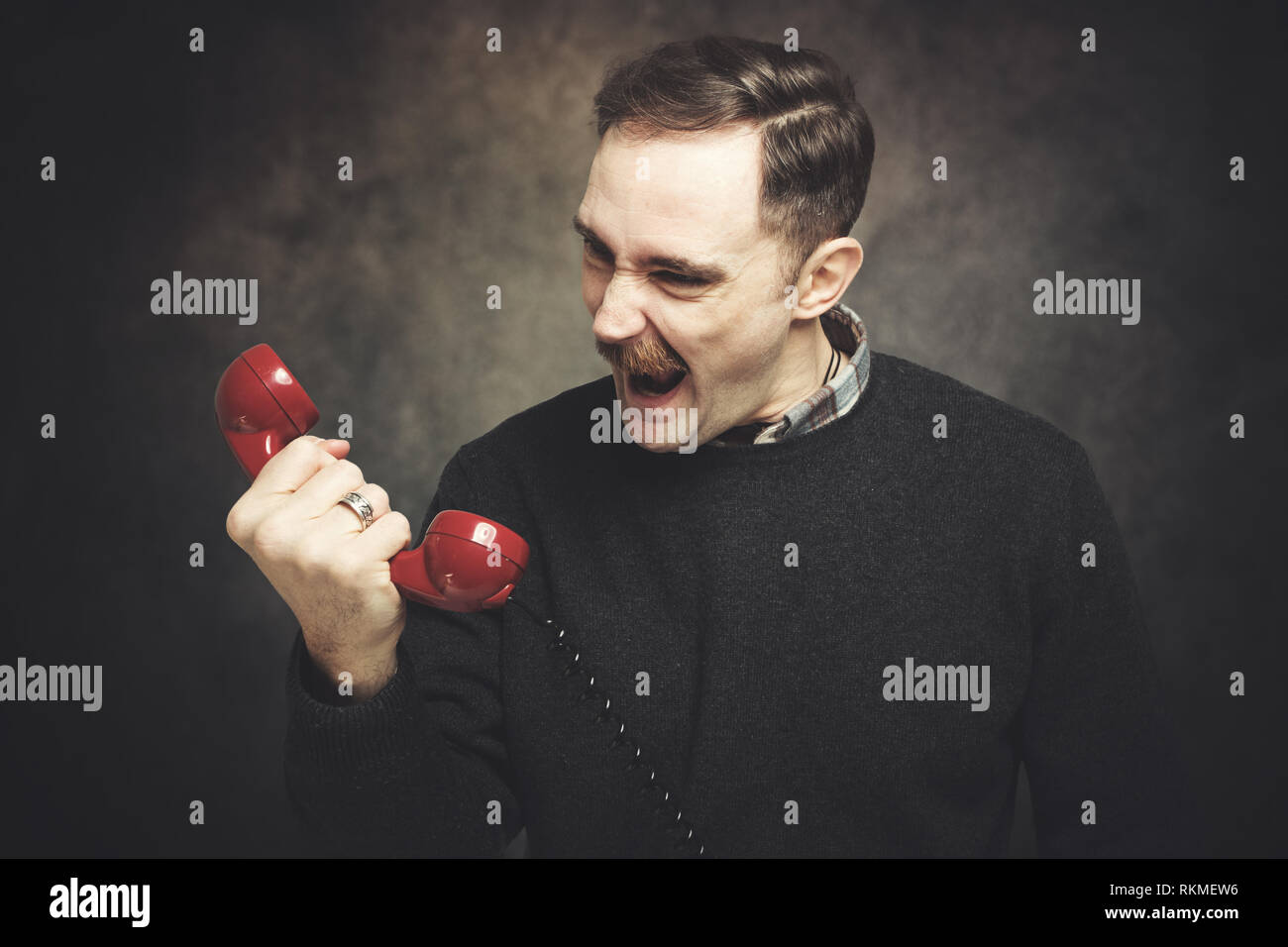 Angry man shouting at the phone Stock Photo - Alamy