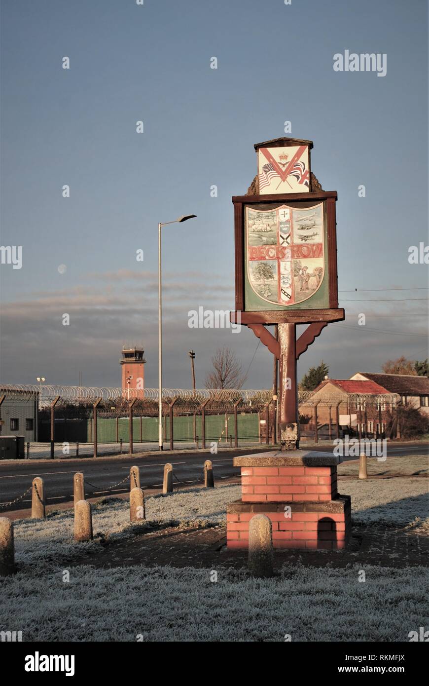 Beck Row village sign on a frosty morning with the moon in the sky ...