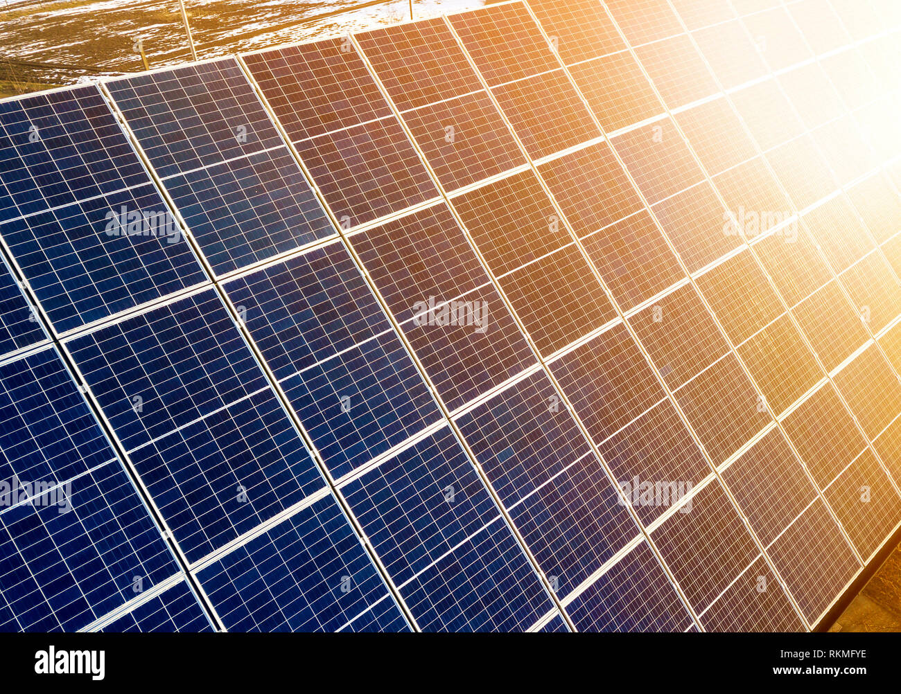 Close-up surface of lit by sun blue shiny solar photo voltaic panels ...