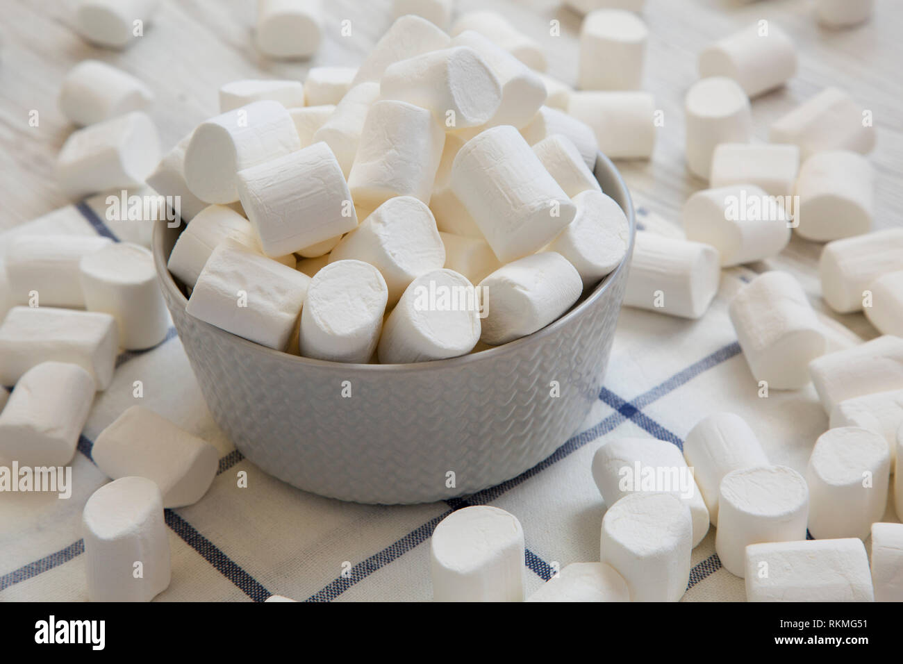 Sweet white marshmallows in a bowl, low angle view. Close-up Stock ...
