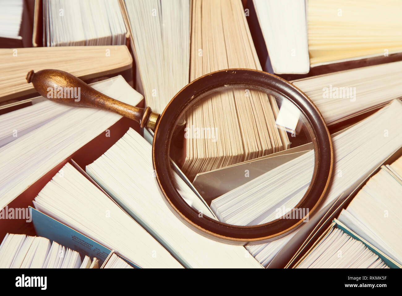 Magnifying glass old books hi-res stock photography and images - Alamy