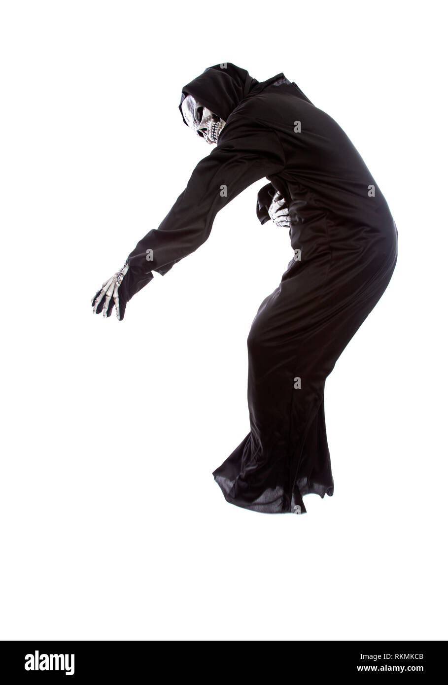 Halloween costume of a skeleton grim reaper wearing a black robe on a ...