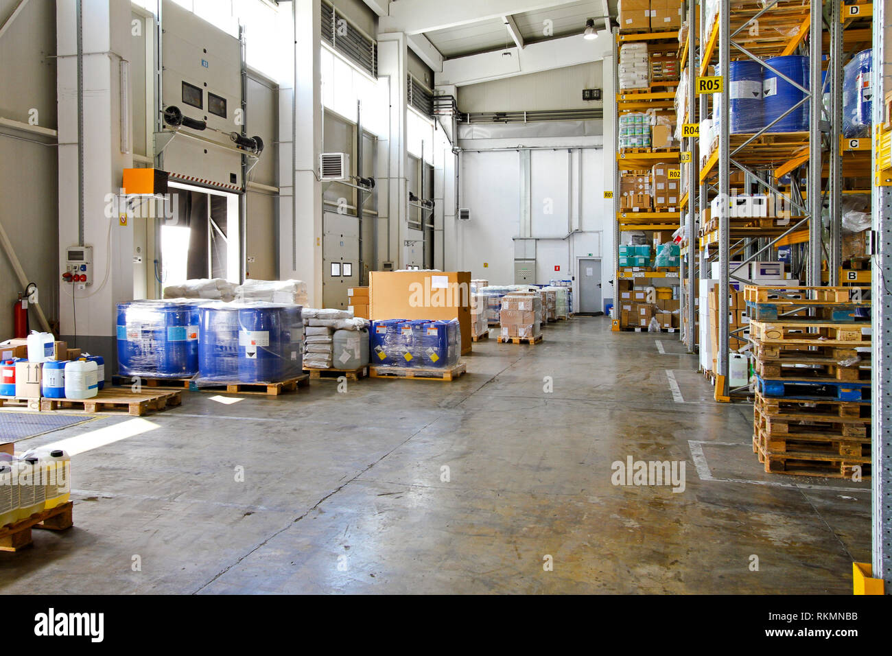 Big storehouse interior with merchandise for distribution Stock Photo ...