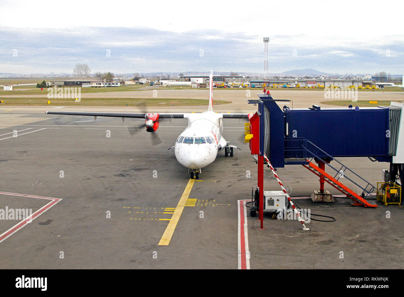 Regional turbo prop plane at airport dock Stock Photo - Alamy