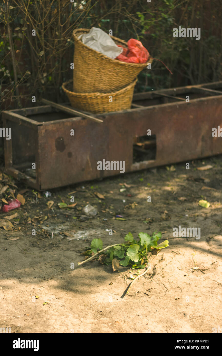 Fallen leaves and a handmade dustbin Stock Photo - Alamy