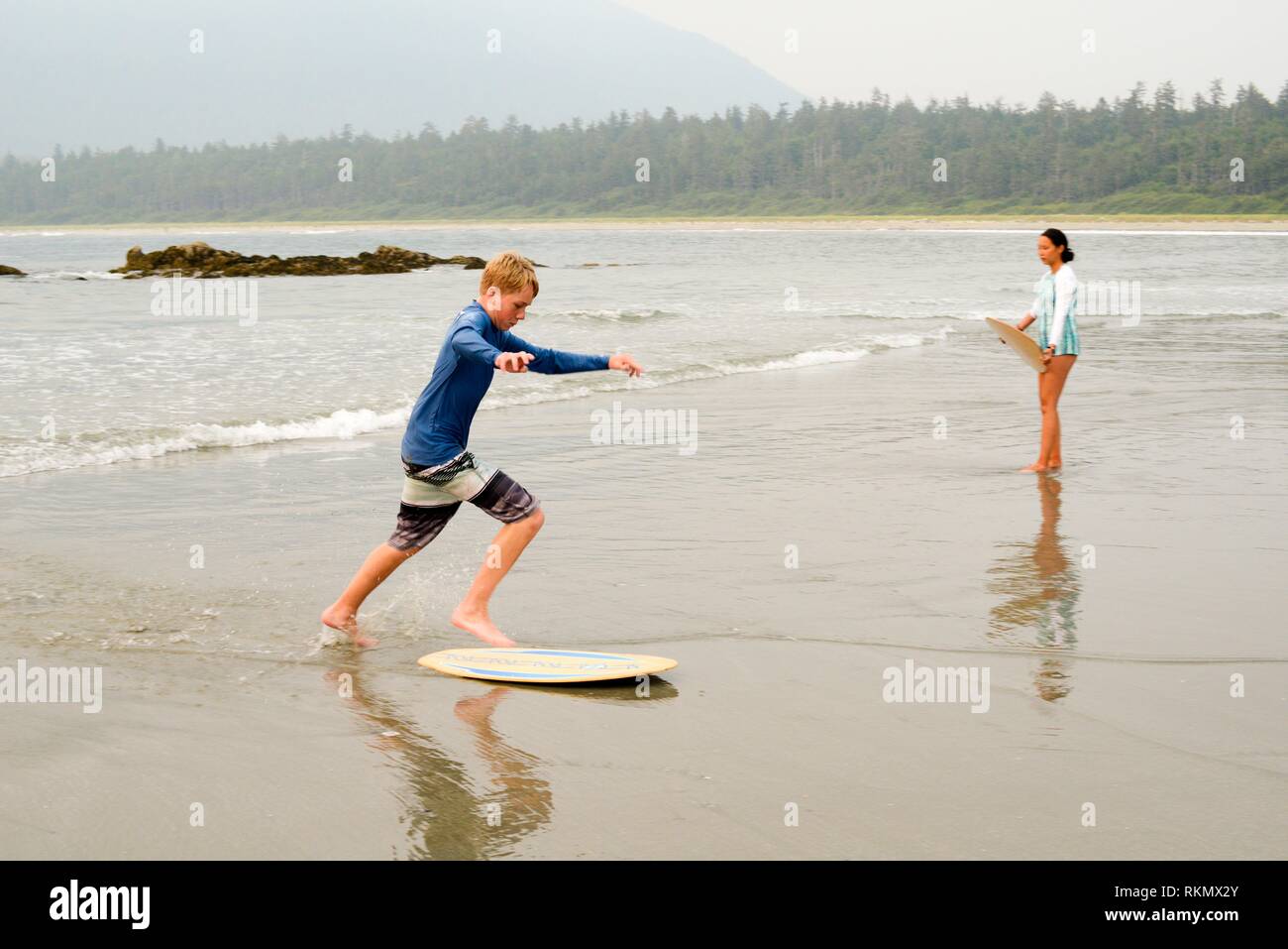 Skim boarding on beach hi-res stock photography and images - Alamy