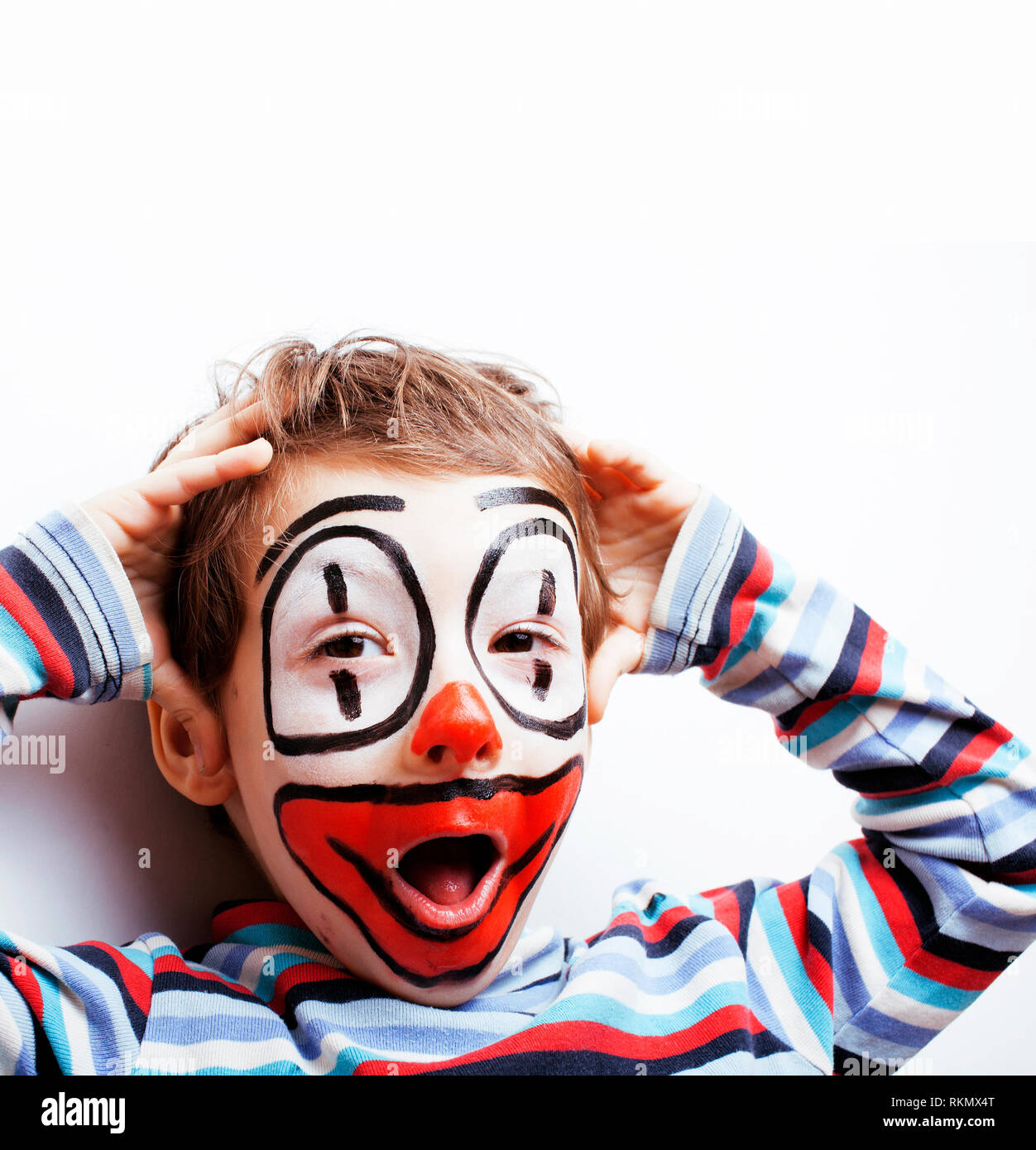 little cute boy with facepaint like clown, pantomimic expressions close ...